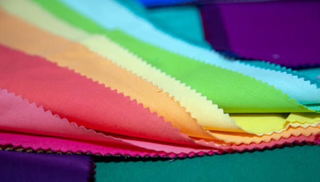 Natural rainbow colorants microbially produced for textile dyeing